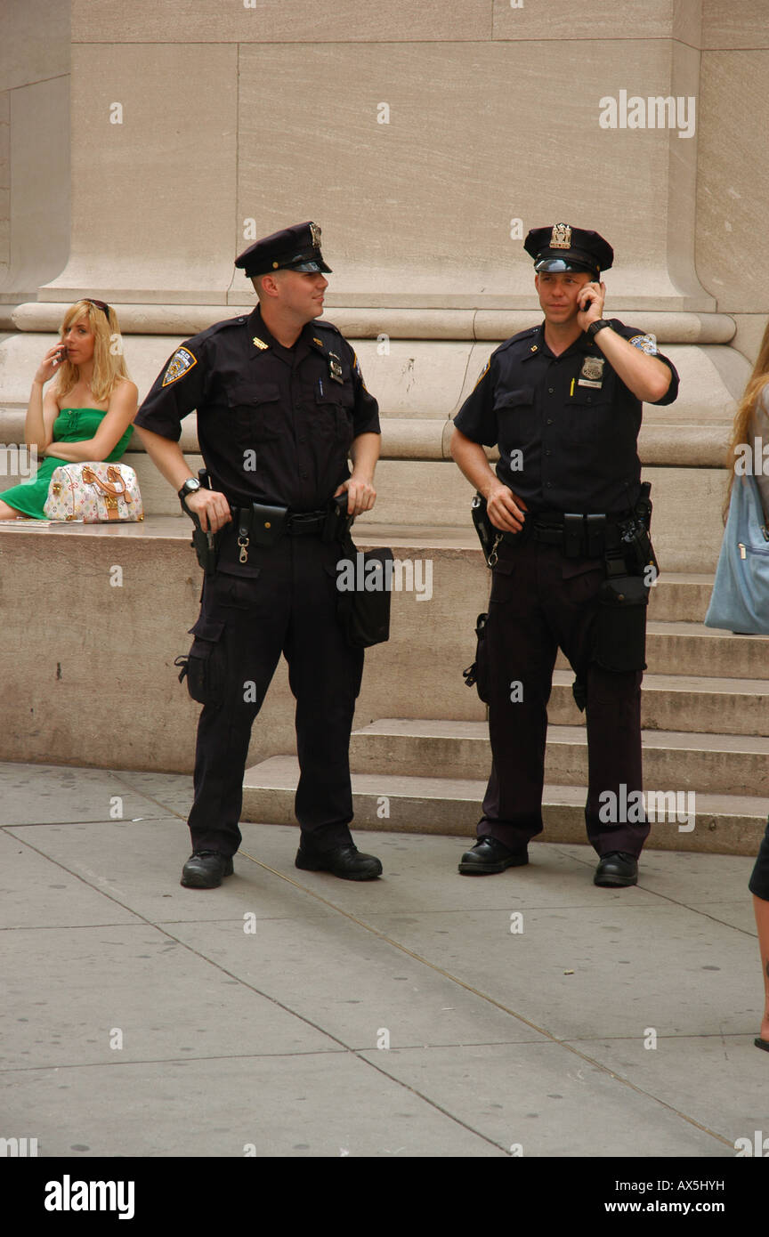 Two policemen in front of Wall Street New York USA Stock Photo - Alamy