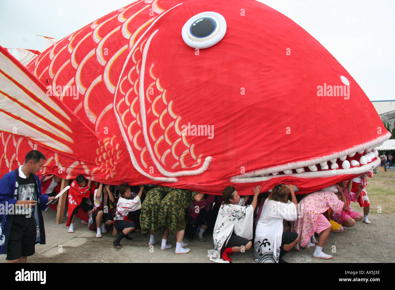 Men carry a giant fish float at a summer festival in Japan Stock Photo ...