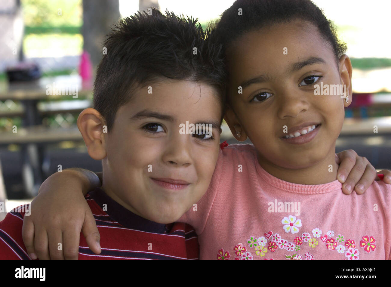Hispanic kids hug friends hi-res stock photography and images - Alamy