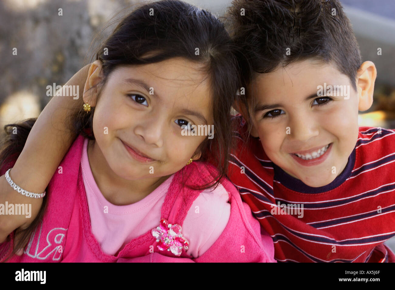 Hispanic kids hug friends hi-res stock photography and images - Alamy