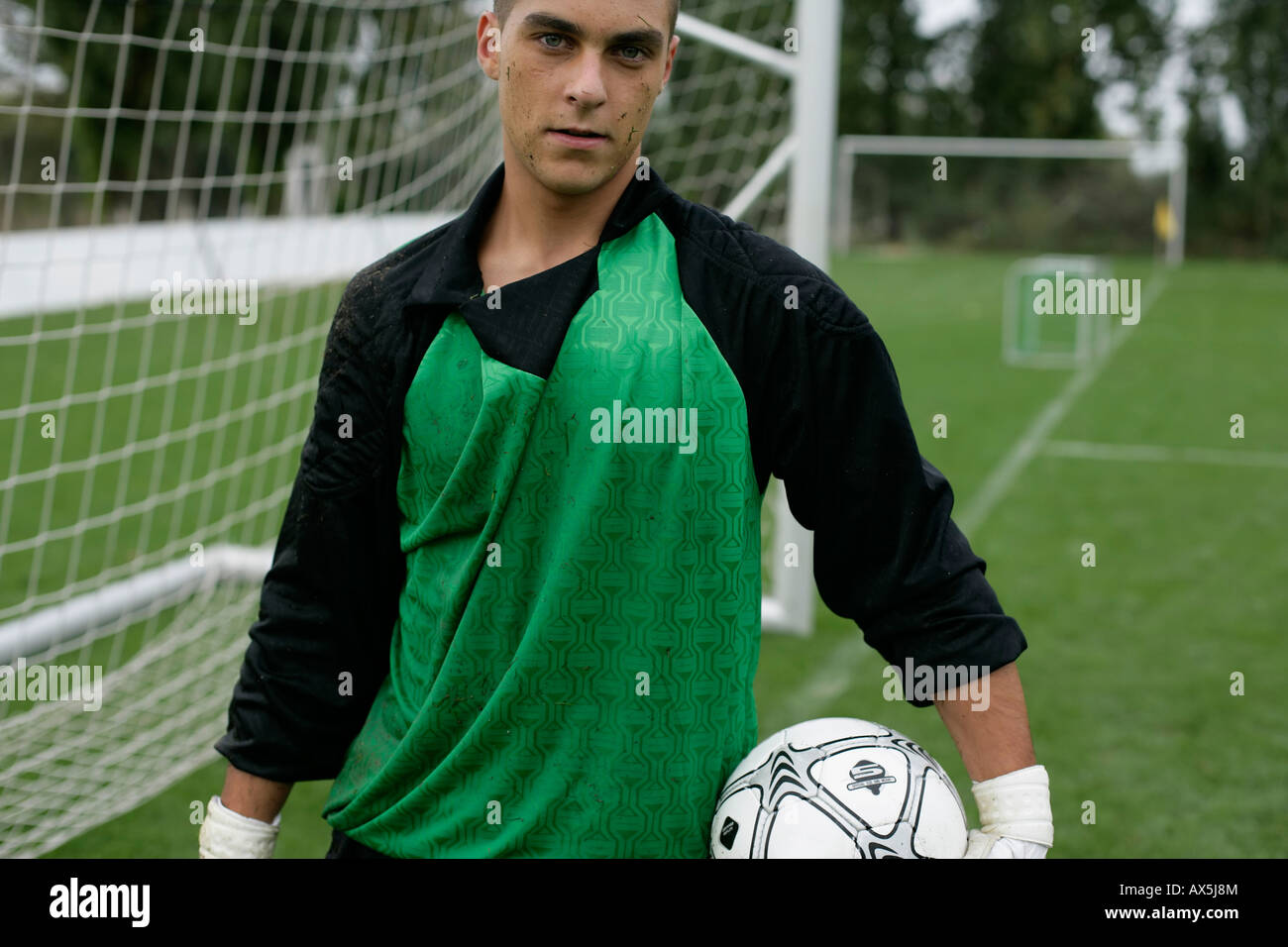 Football player ball under arm hi-res stock photography and images - Alamy