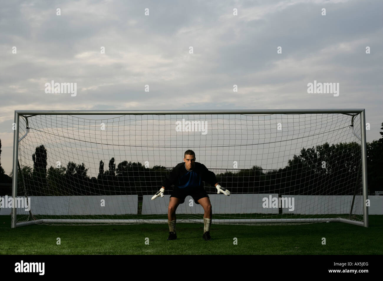 Goalkeeper standing in a goal Stock Photo - Alamy