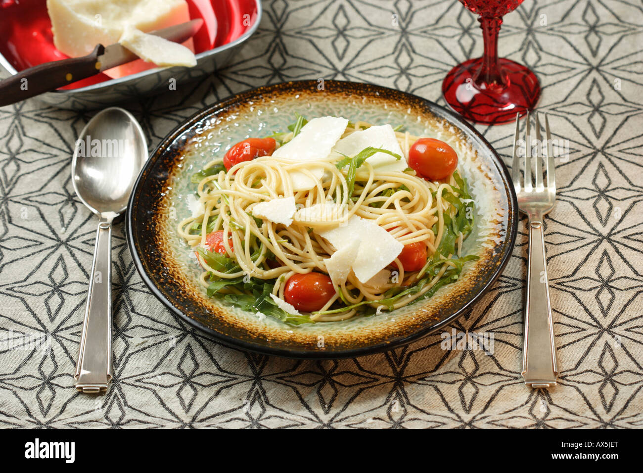 Spaghetti with rocket, cocktail tomatoes and fresh grinded Parmesan ...