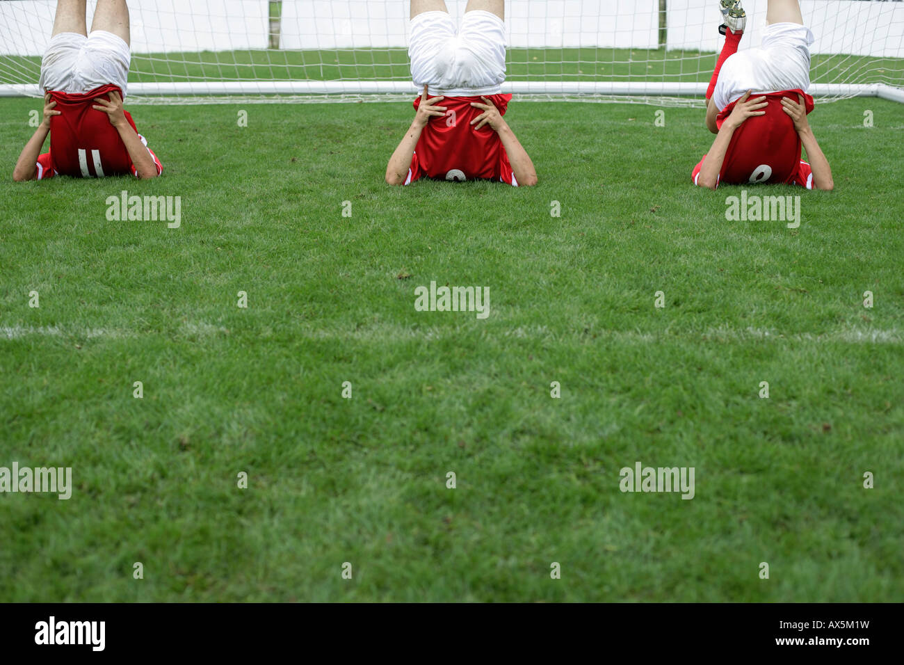 Soccer players doing stretching exercise in front of the goal Stock ...