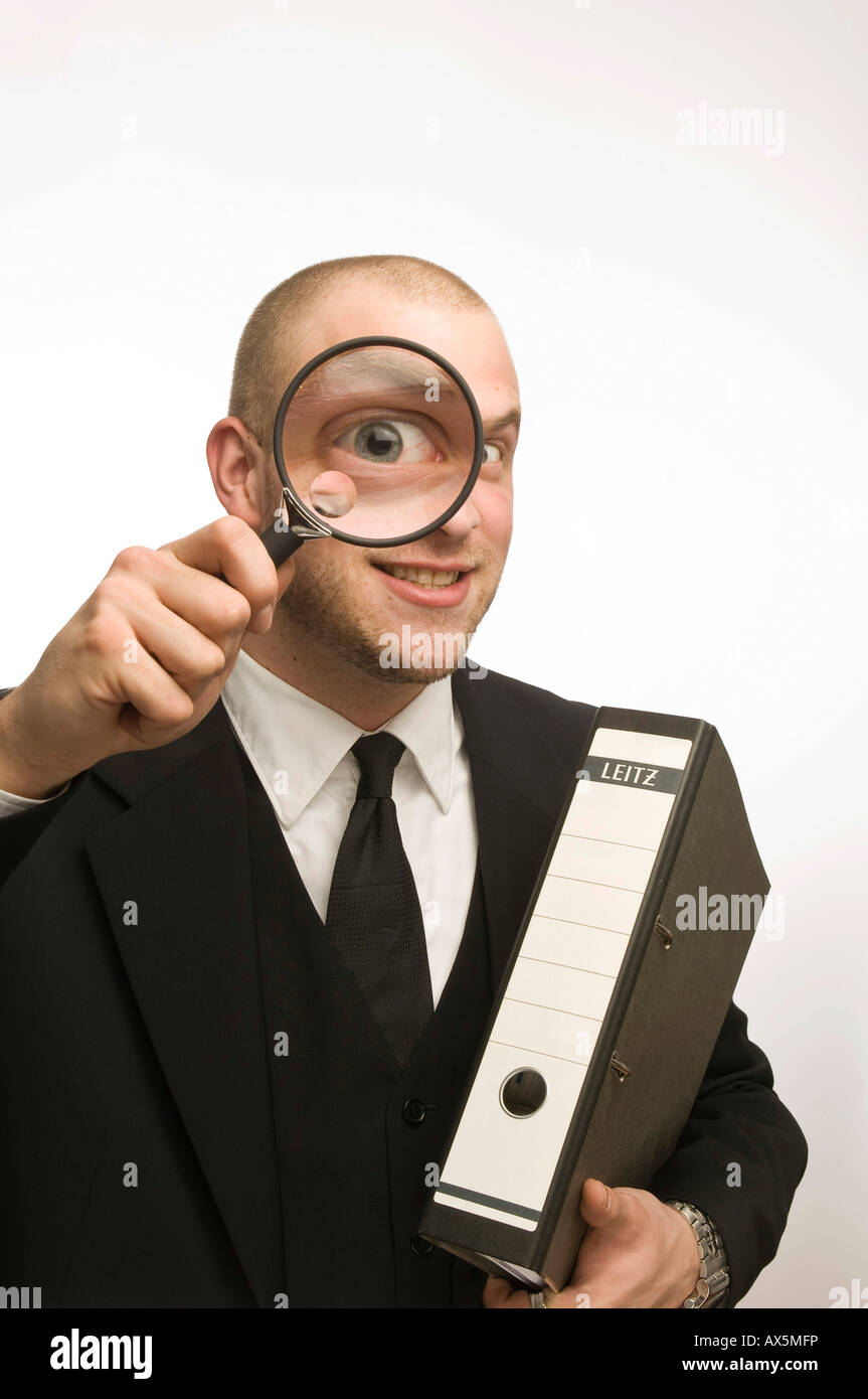 Business man hold magnifying glass High Resolution Stock Photography ...