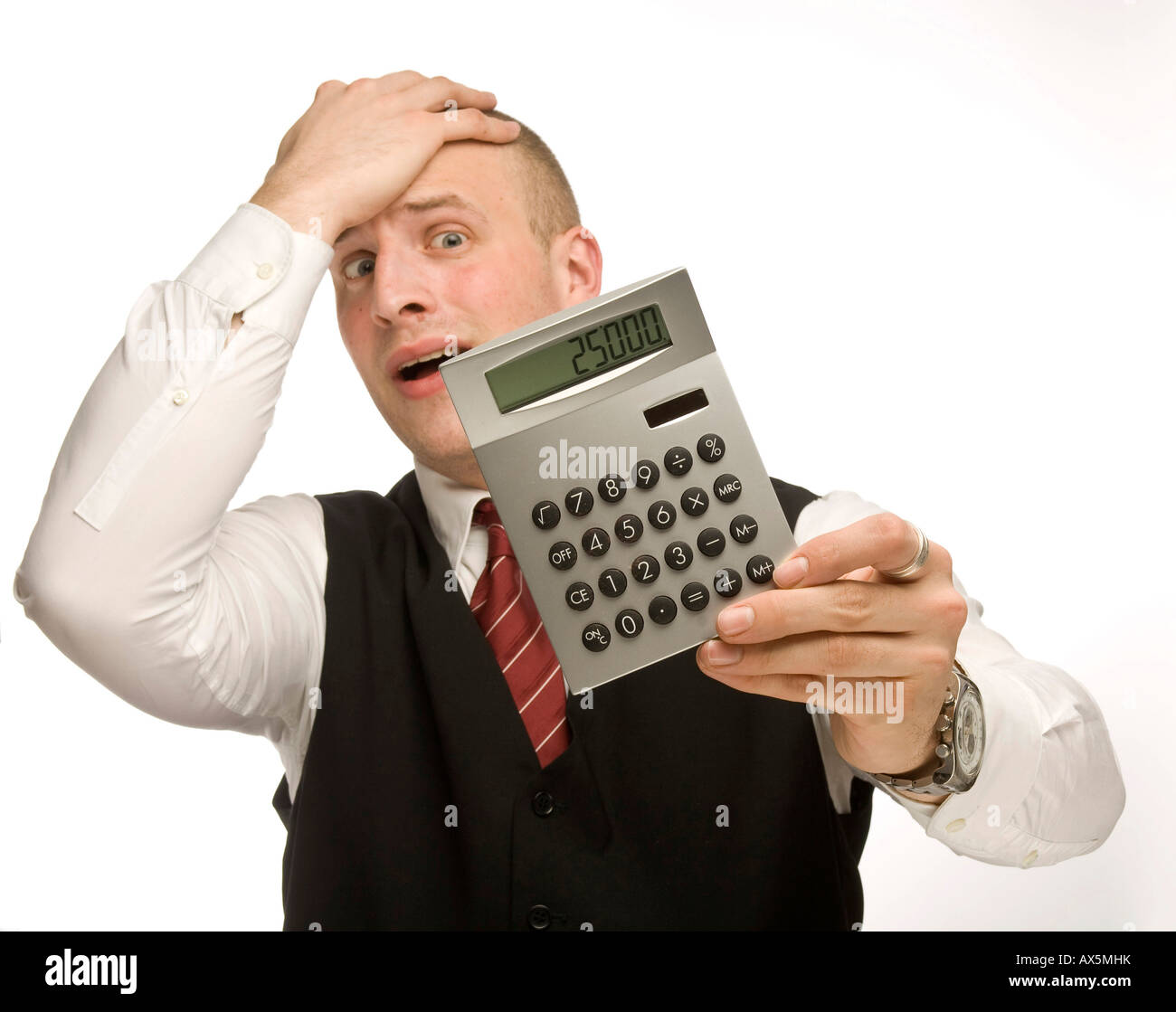 Young man holding a calculator Stock Photo - Alamy