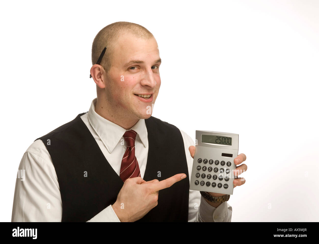 Young man holding a calculator Stock Photo - Alamy