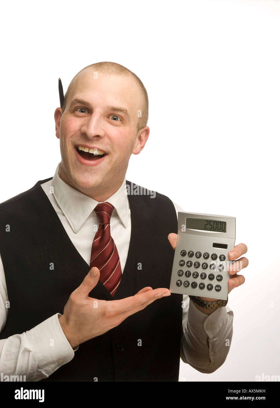 Young man holding a calculator Stock Photo - Alamy