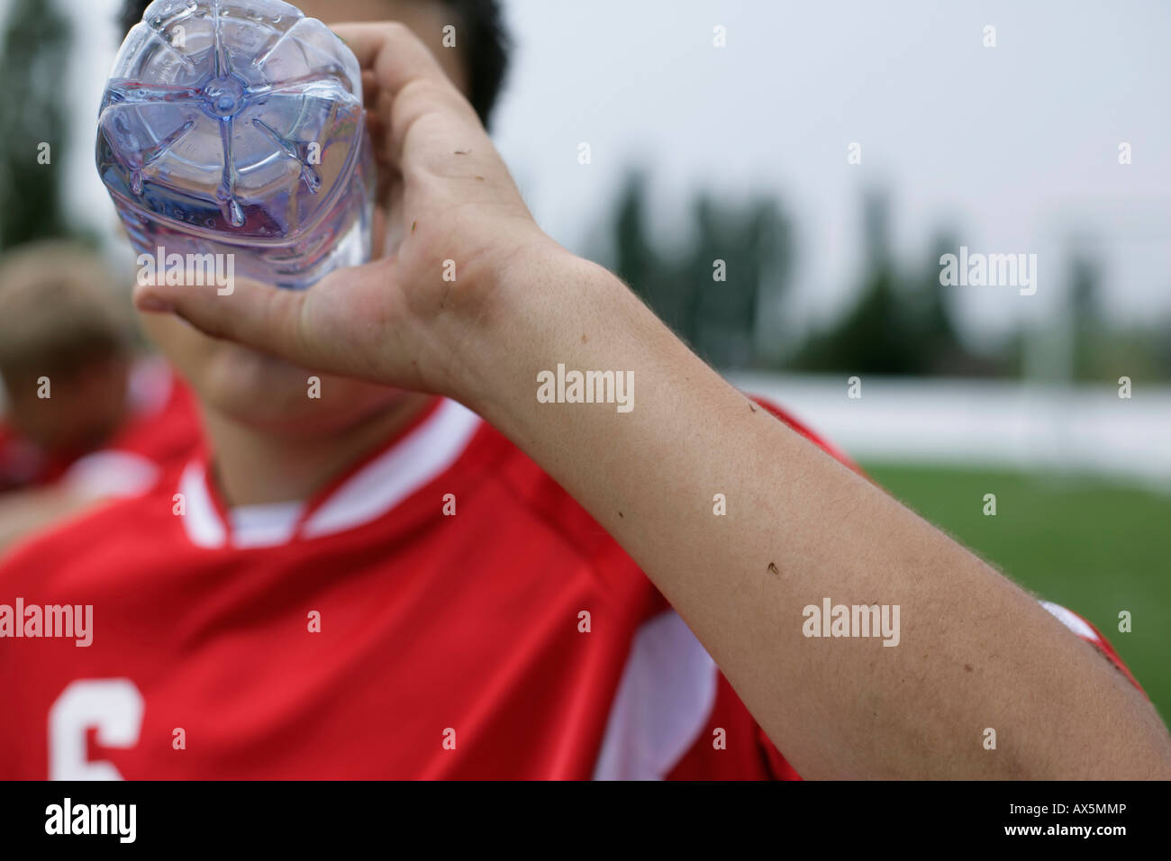 Soccer player drinking water Stock Photo - Alamy