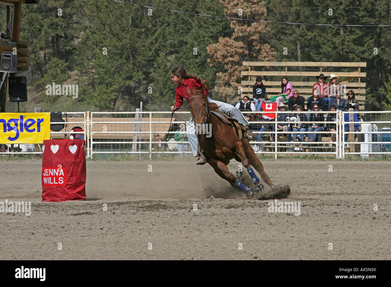Barrel racing at a rodeo Stock Photo - Alamy
