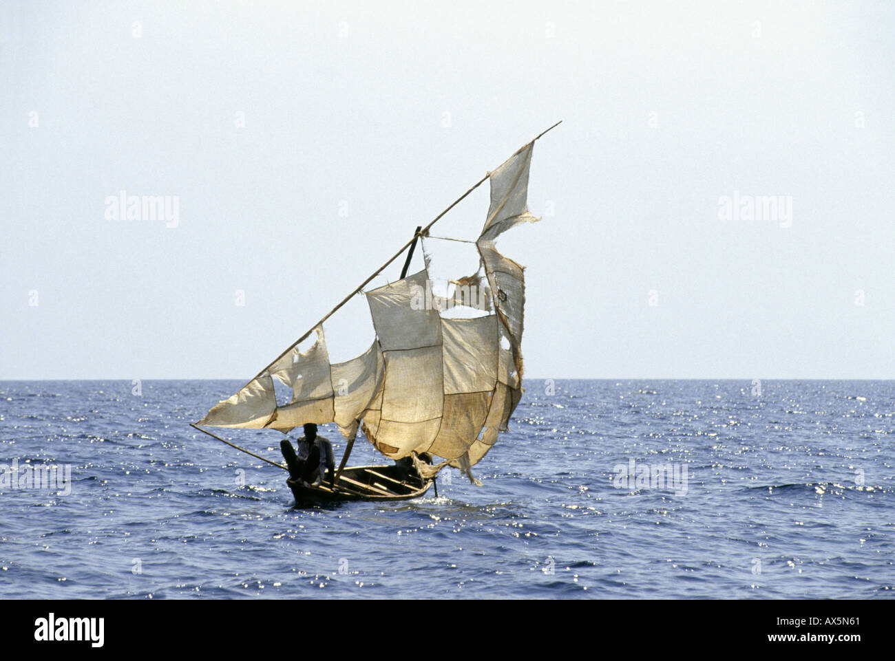 Tanzania. Dhow with ragged sail on Lake Tanganyika Stock Photo - Alamy