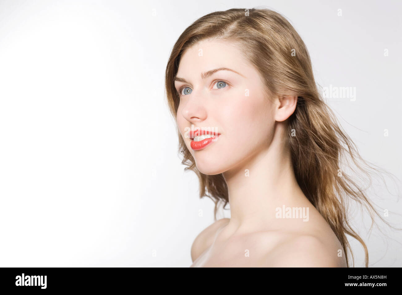 Portrait of a young woman, her hair flowing Stock Photo - Alamy