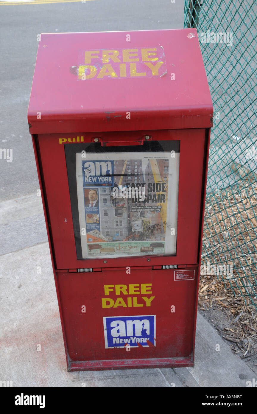 Passers-by can help themselves to free newspapers from a street corner ...