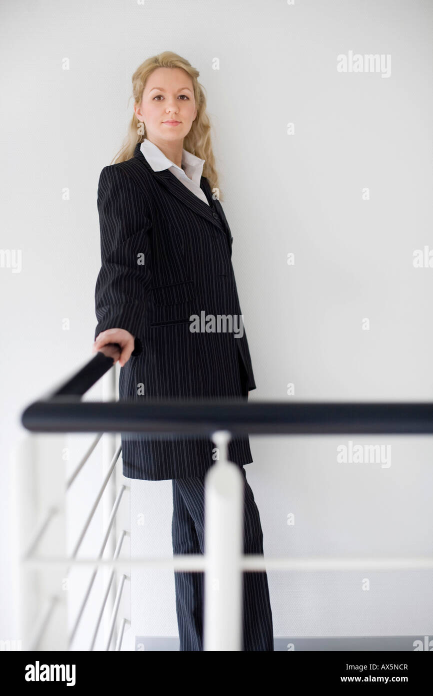 Woman leaning against railings hi-res stock photography and images - Alamy
