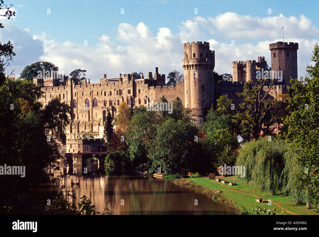 Warwick Castle overlooking the River Avon, lies in the town of Warwick ...
