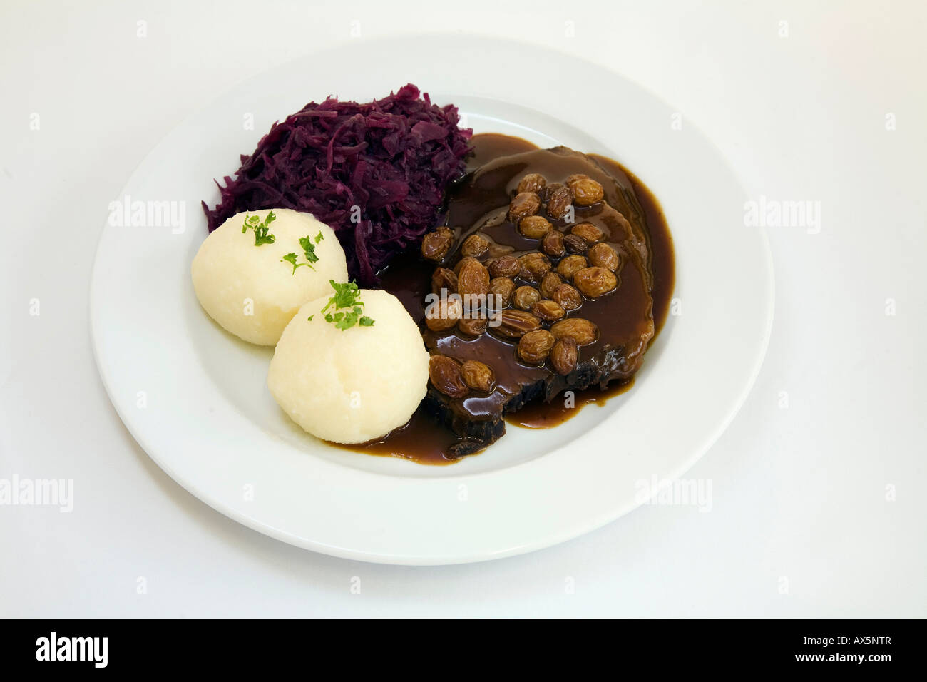 Rhenisch Sauerbraten (marinated beef roast) with potato dumplings and ...
