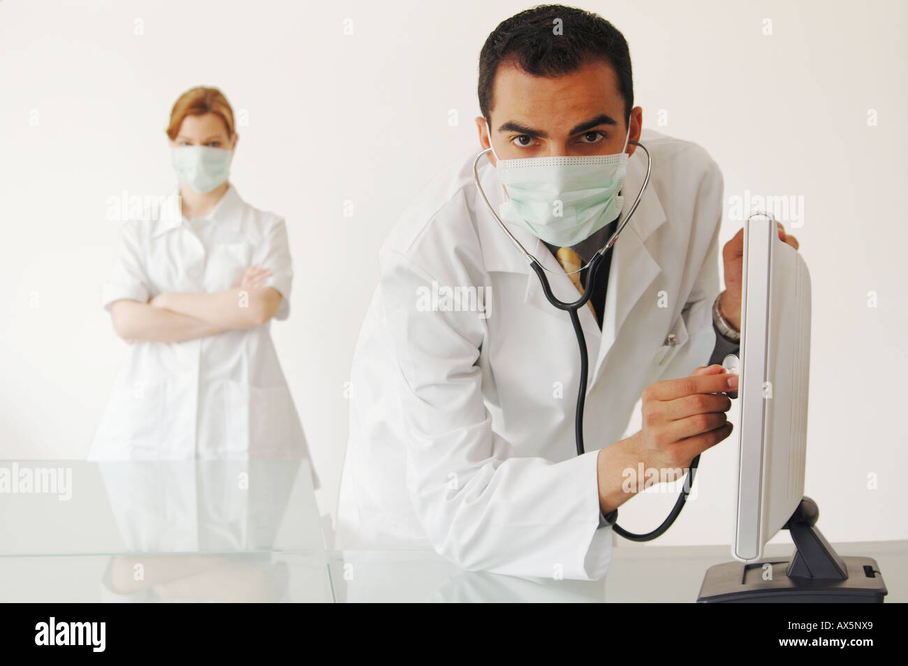 Doctor examining computer screen Stock Photo - Alamy