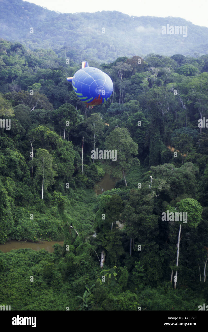 Makande, Gabon. The Dirigible from the front flying over a river in the ...