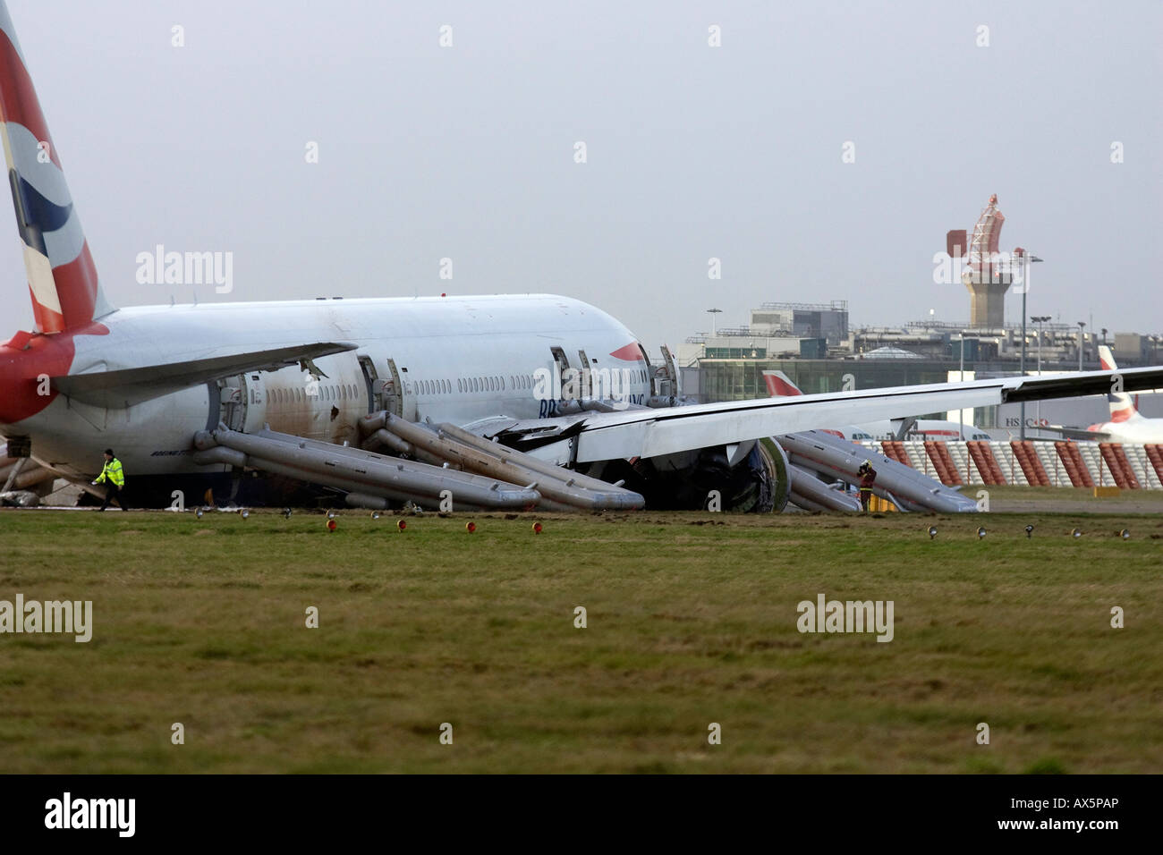 The crashed BA jet lies on the Heathrow grass short of the runway at ...