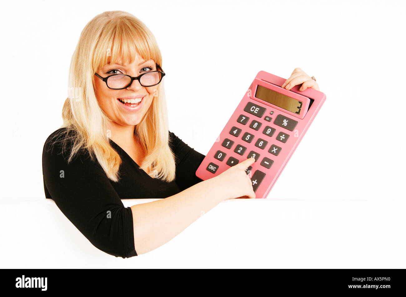 Person looking at calculator Cut Out Stock Images & Pictures - Alamy