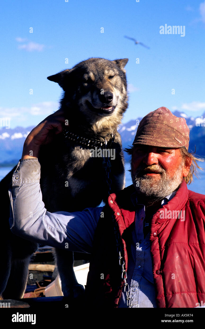 Salmon Fisherman and Wolf at Valdez Alaska USA Stock Photo - Alamy