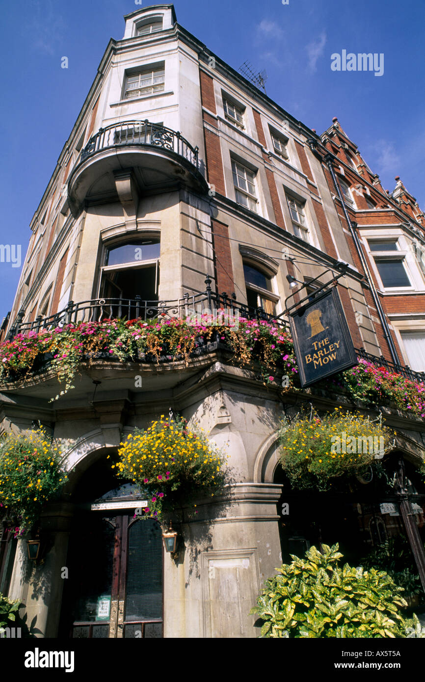 Architecture of corner pub The Barley Mow and beautiful flowers in ...