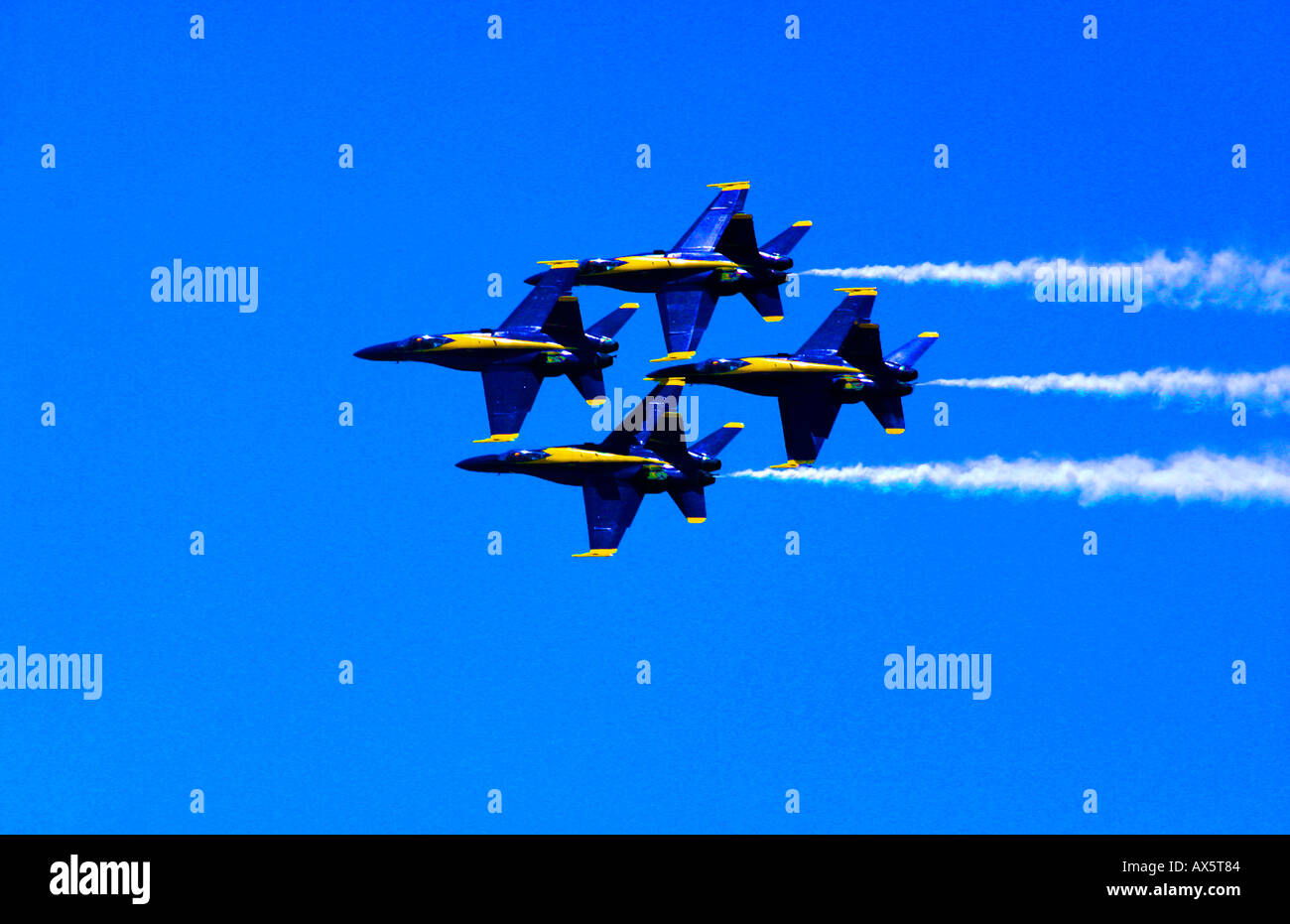 The Blue Angels FA 18s fly in diamond formation with trails of white ...