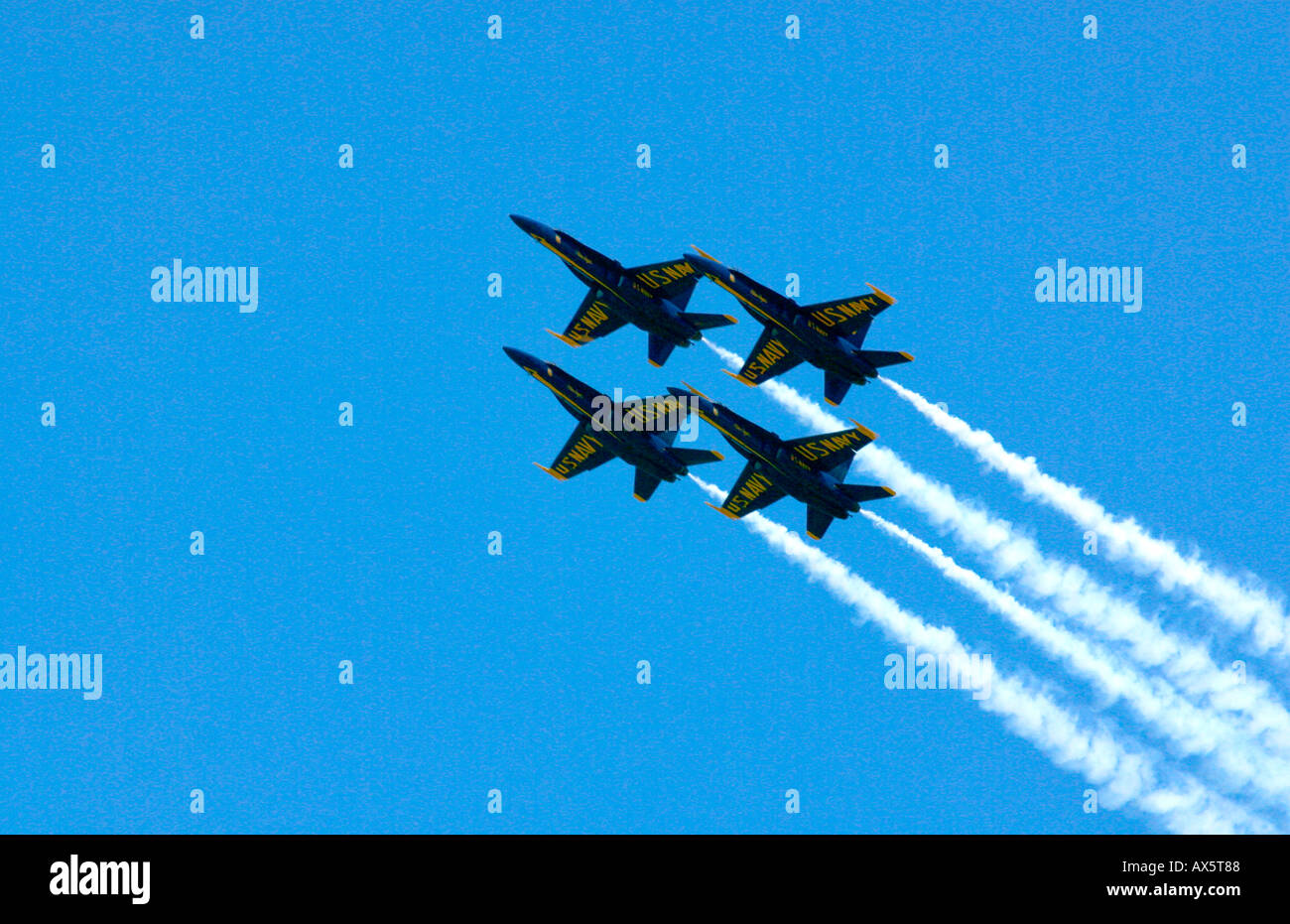 The Blue Angels FA 18s fly in diamond formation with trails of white ...