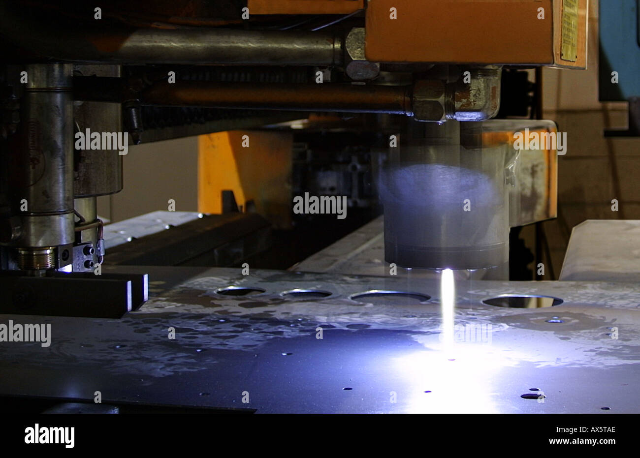 A robotic plasma cutting machine in a manufacturing facility Stock ...