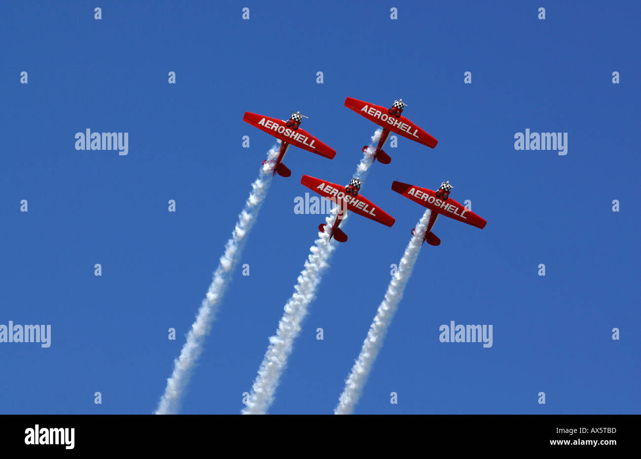 The planes of the Aeroshell demonstration team leave trails of white ...