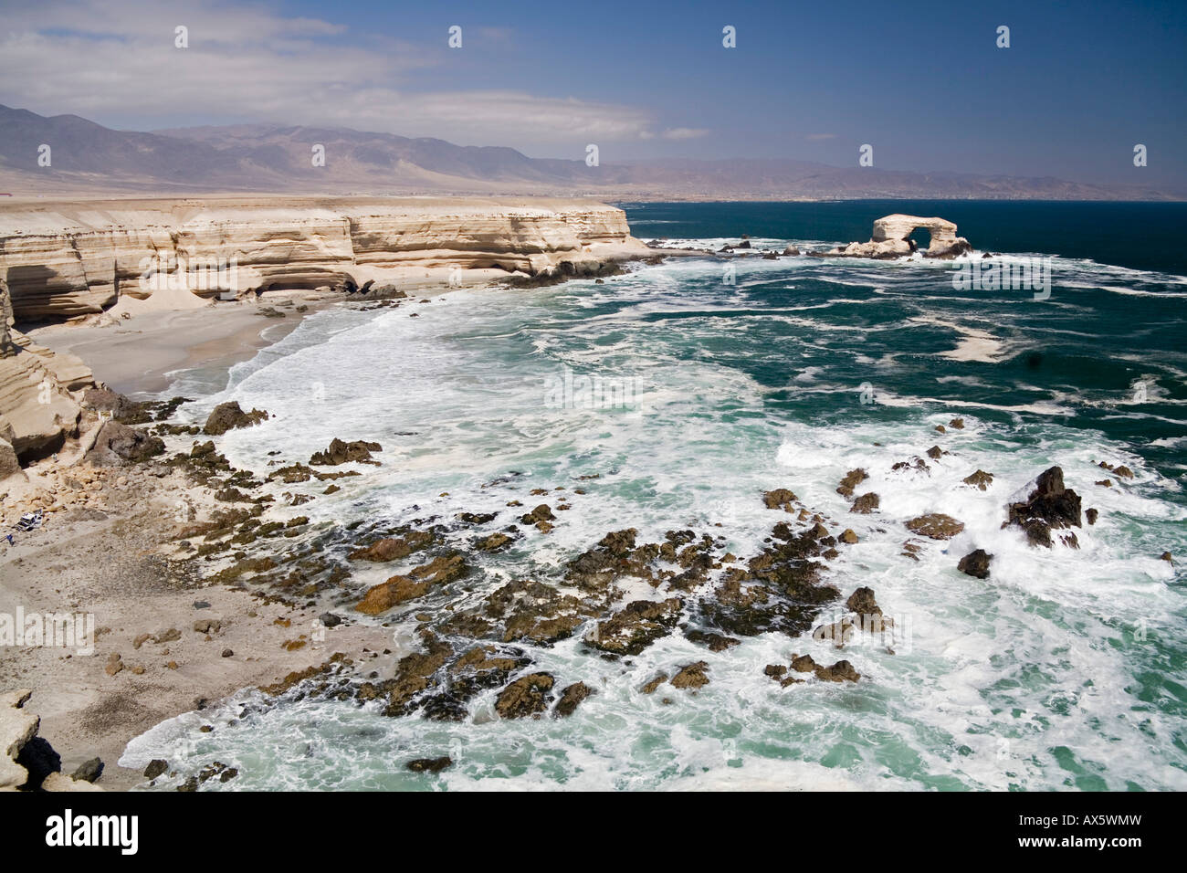 The coast and the natural arch La Portada, landmark from the town and ...