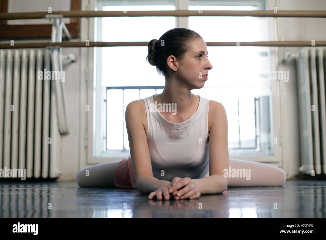 A female ballet dancer lying on the floor Stock Photo - Alamy