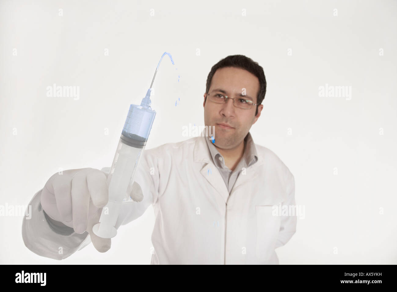 Chemist testing a syringe Stock Photo - Alamy