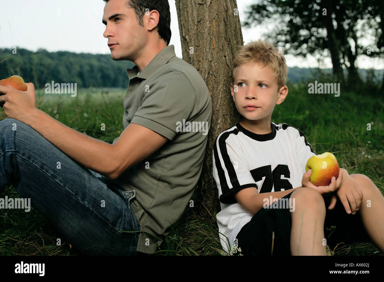Father son apple tree hi-res stock photography and images - Alamy