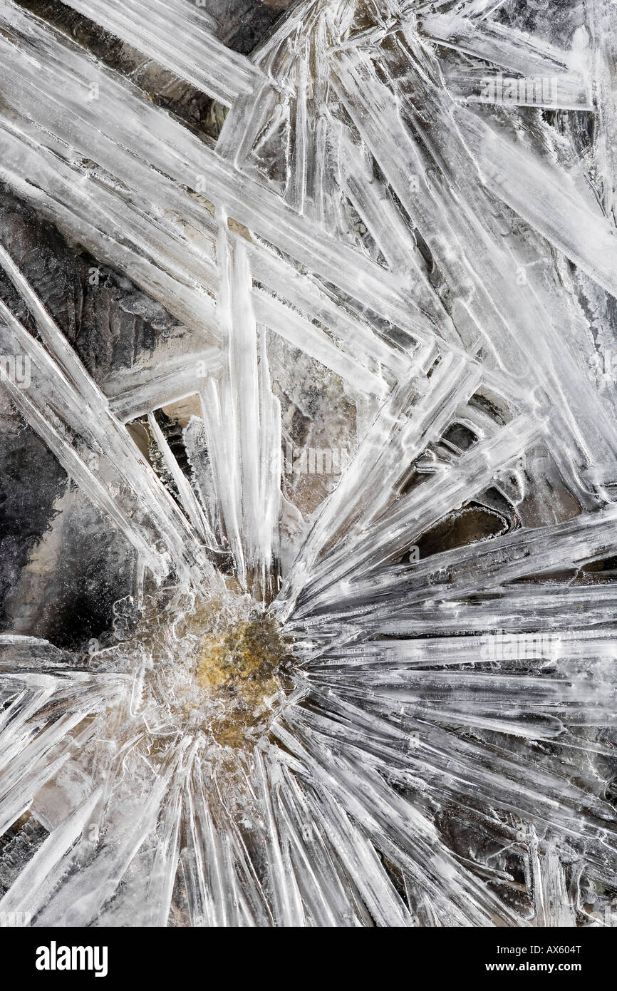 Stone frozen in ice, interesting ice formations Stock Photo - Alamy