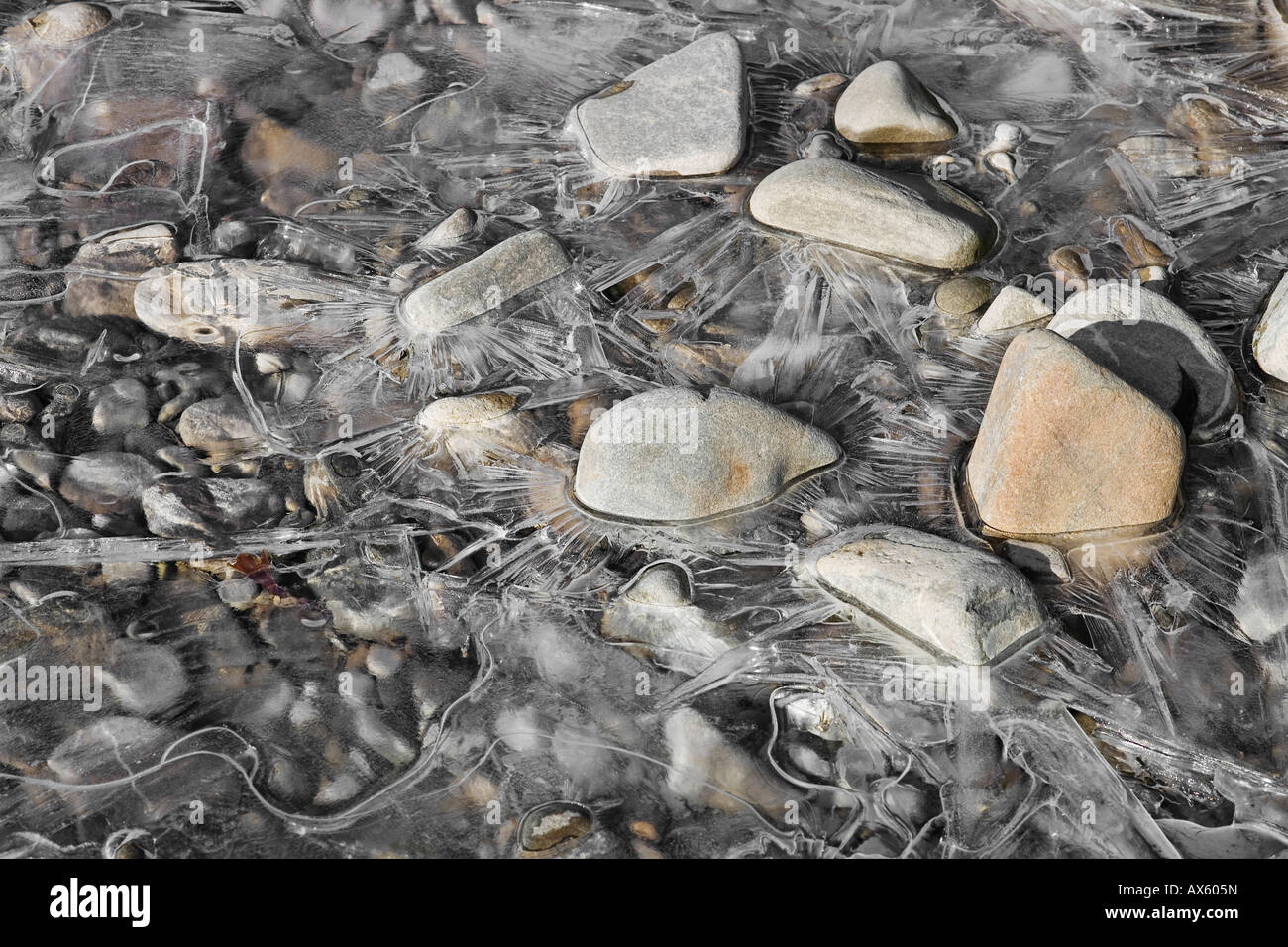 Stones frozen in ice, interesting ice formations Stock Photo - Alamy