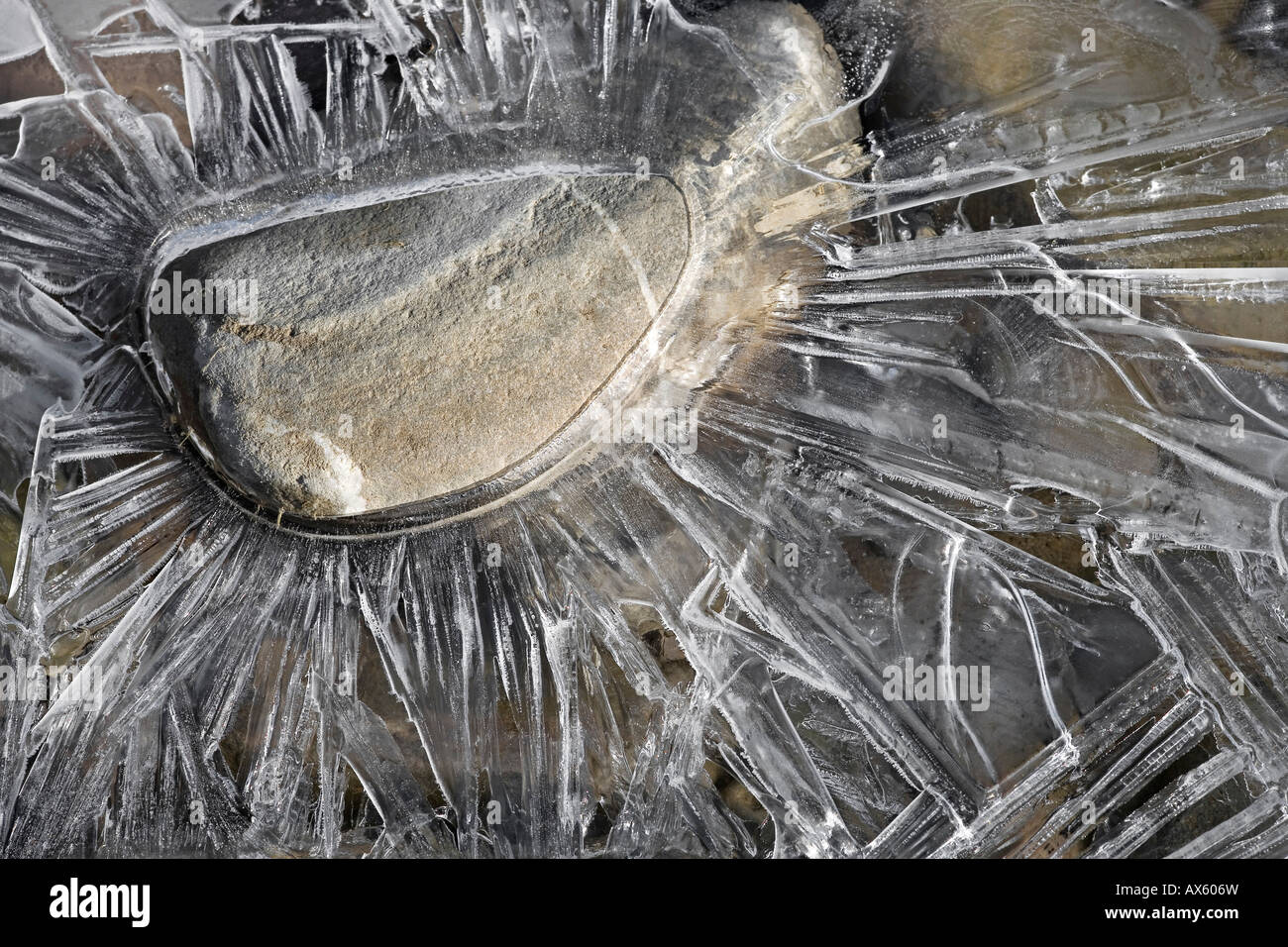 Stone frozen in ice, interesting ice formations Stock Photo - Alamy