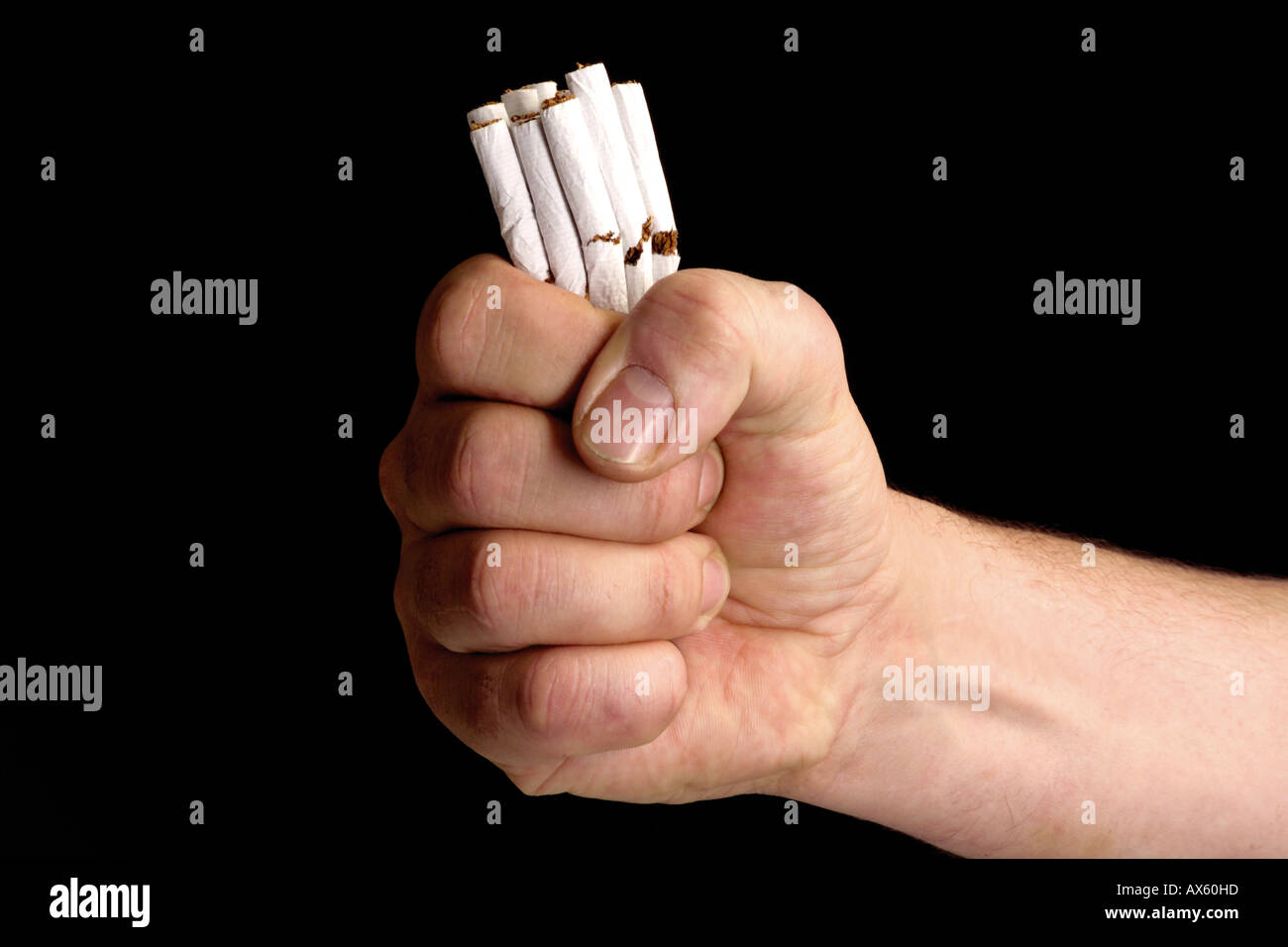 Man crushing cigarettes Stock Photo - Alamy