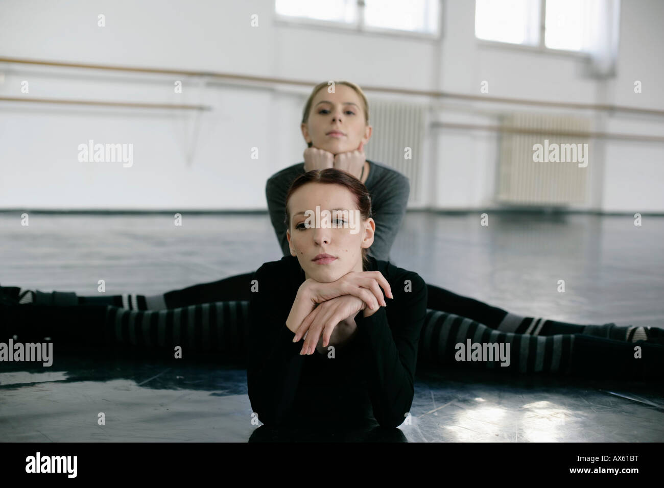 Female ballet dancers doing the splits on the floor Stock Photo - Alamy
