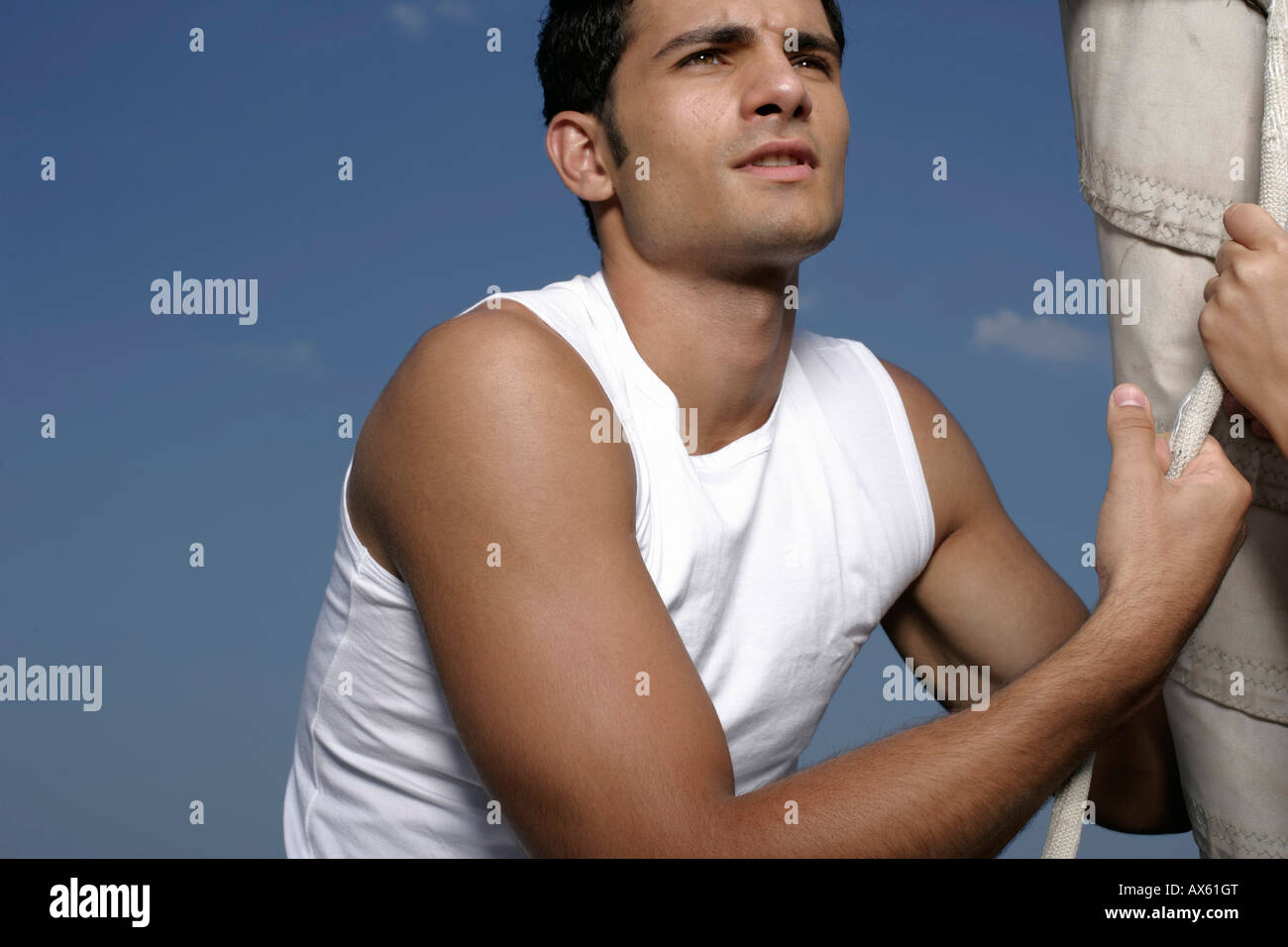 Man holding a rope Stock Photo - Alamy
