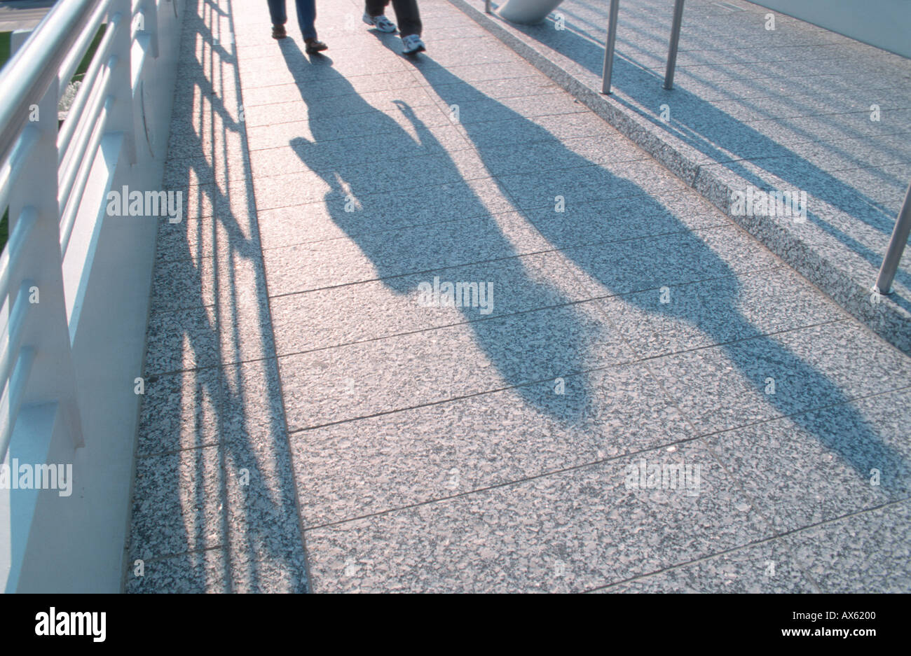 Long sunset people shadows on Milwaukee art museum bridge, Lake ...
