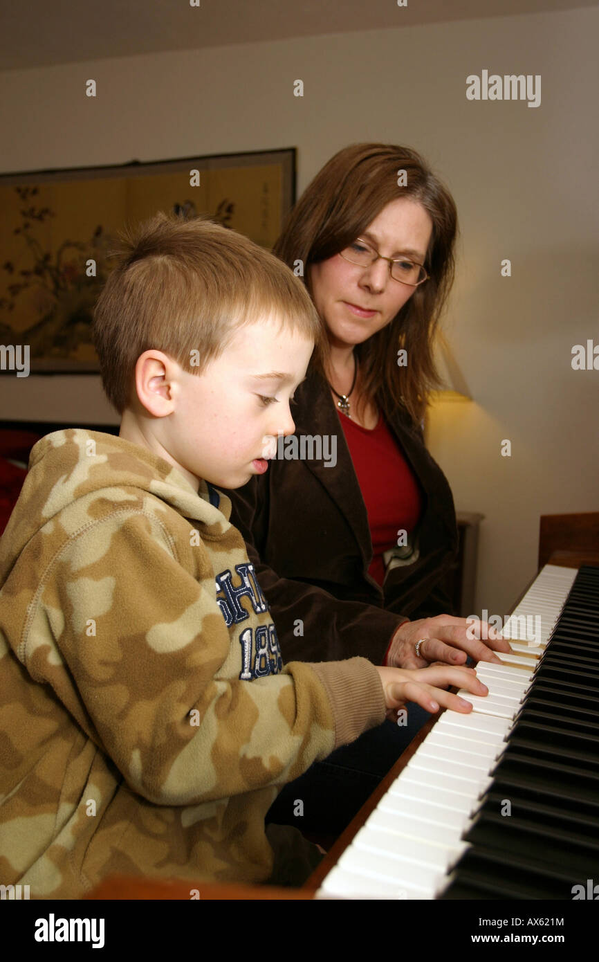 young boy having piano lessons Stock Photo - Alamy