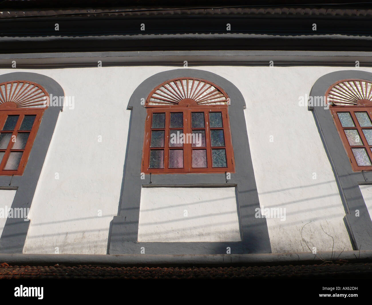 The attractive facade and decorative windows of an old building in Sao ...