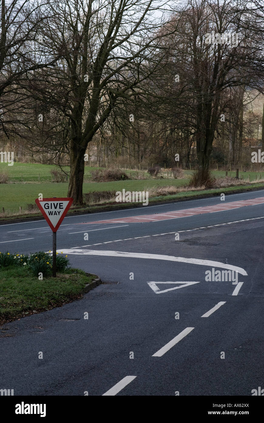 junction with give way sign Stock Photo - Alamy