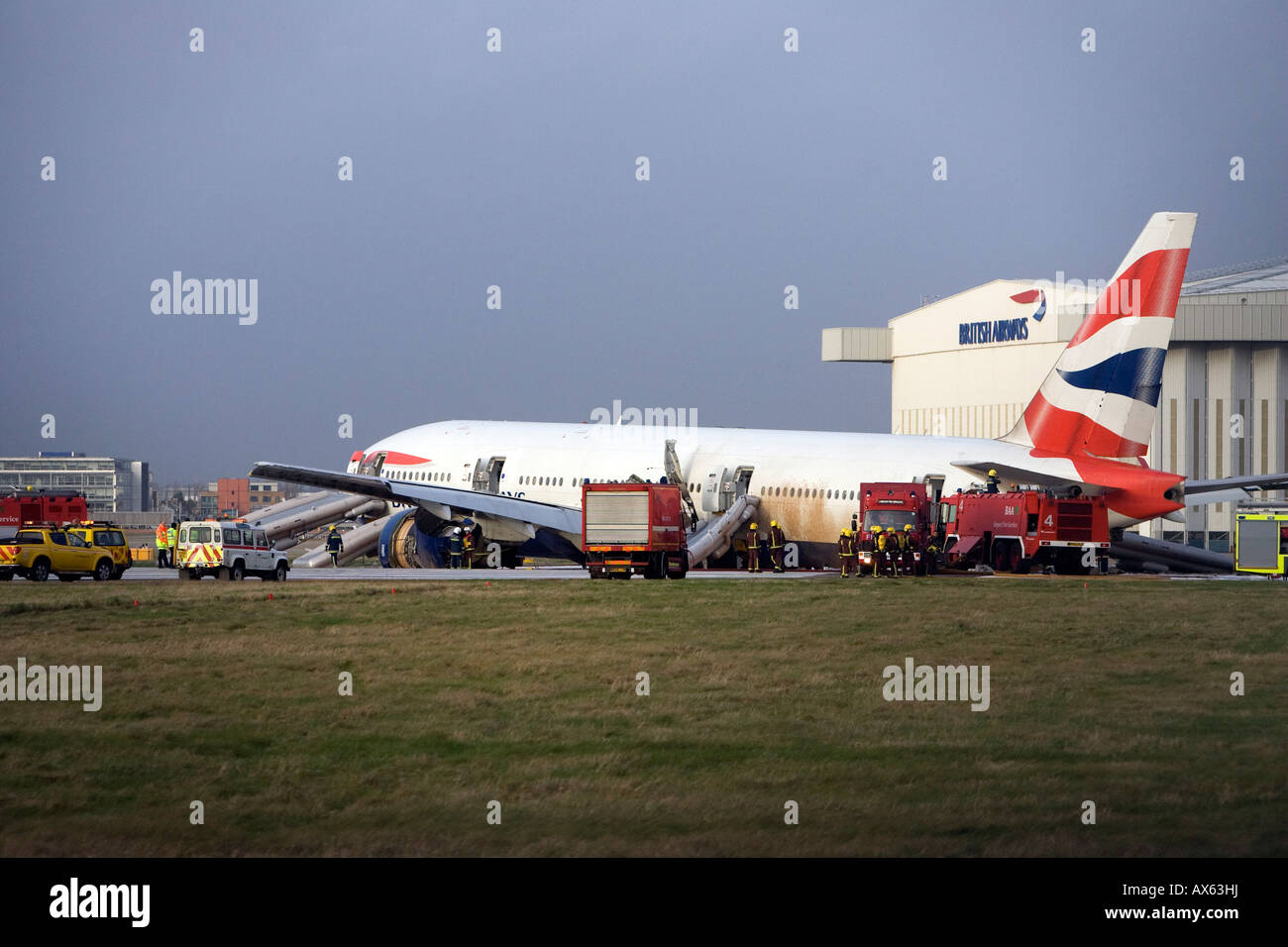 The crashed BA Boeing 777 jet lies on the Heathrow grass short of the ...
