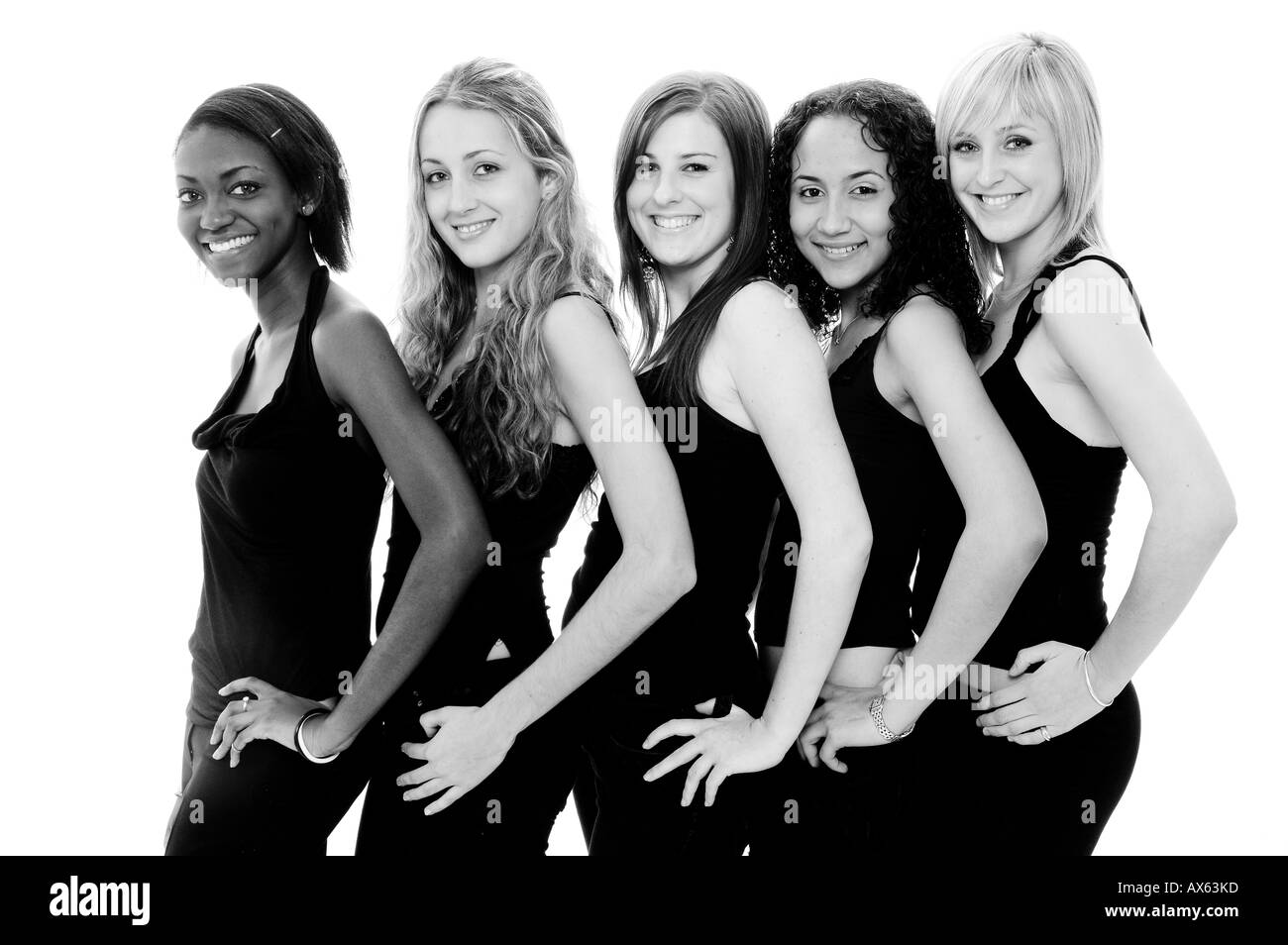 Five pretty teenage girls in black on white background Stock Photo - Alamy