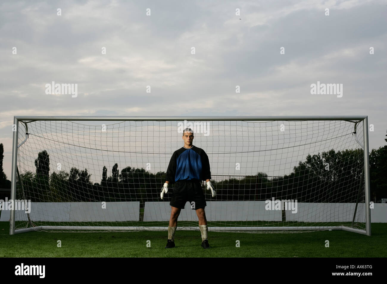 Goalkeeper standing in a goal Stock Photo - Alamy