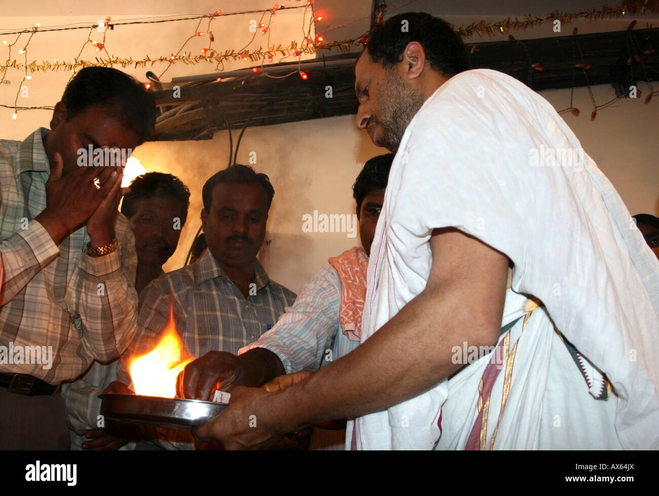 Hindu worshipper taking Arti or fire pooja , Ganesh Chaturthi , India ...