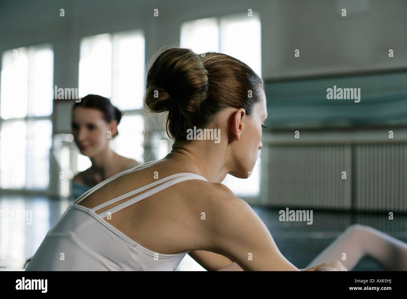 Female ballet dancers sitting on the floor Stock Photo - Alamy