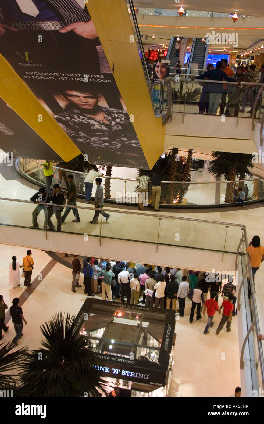 Shops and escalators inside a modern Indian shopping mall and shopping ...